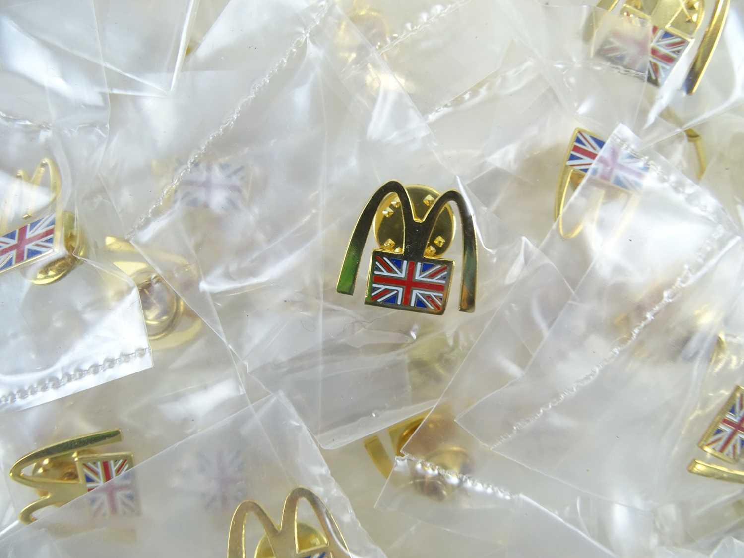 Lot 316 - A large quantity of MCDONALDS pins featuring