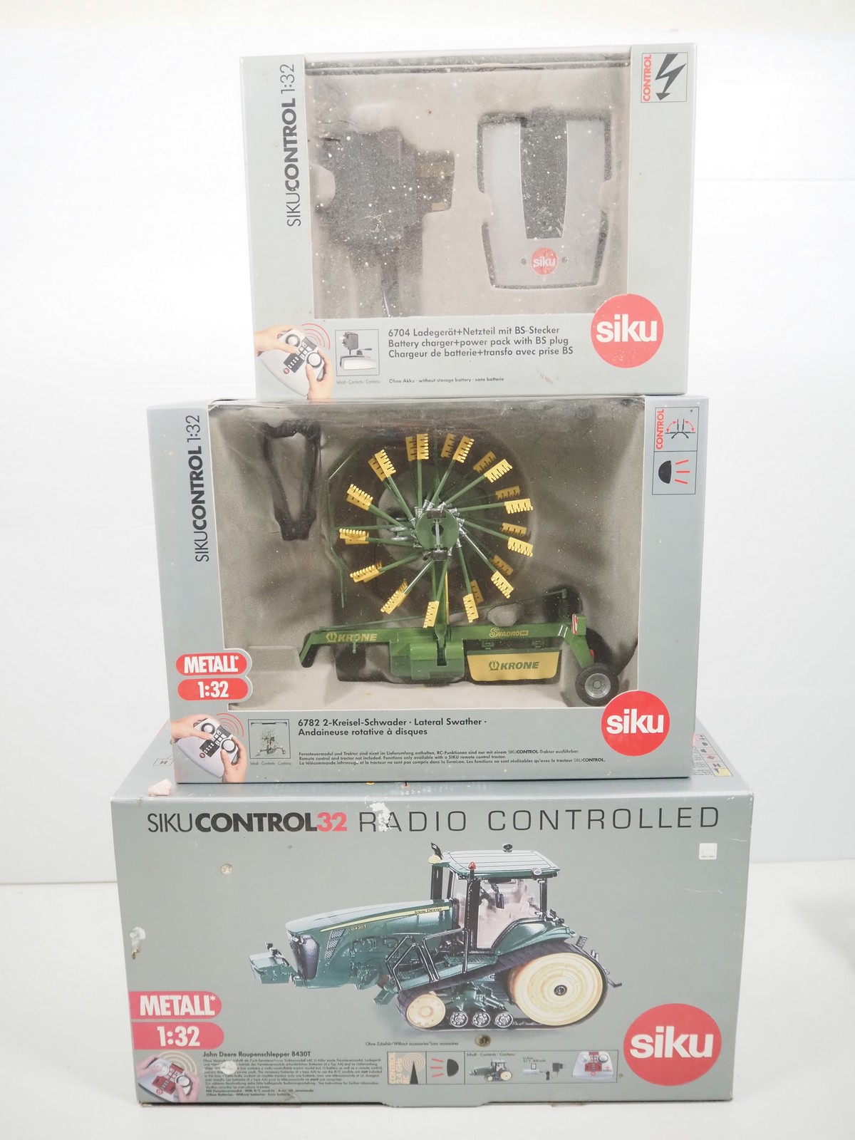 Lot 42 - A group of 1:32 scale SIKU radio controlled