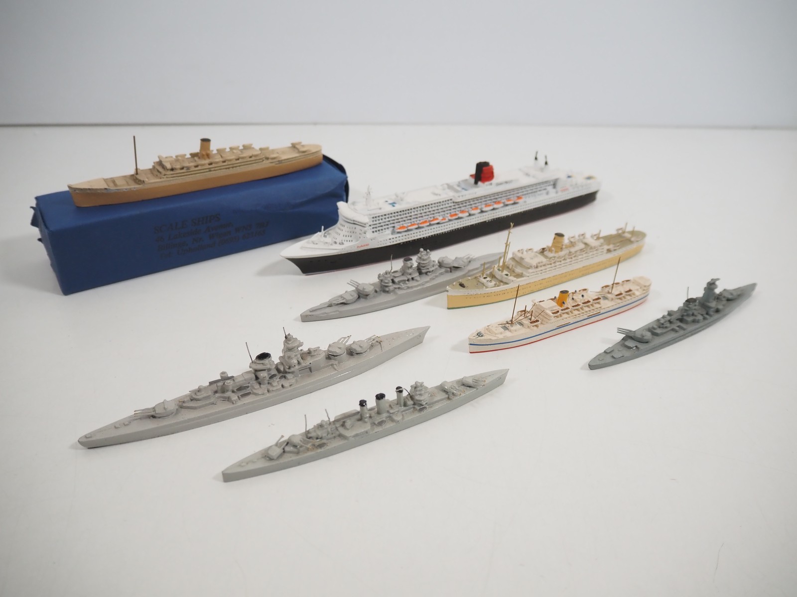 Lot 59 - A group of waterline ship models in various