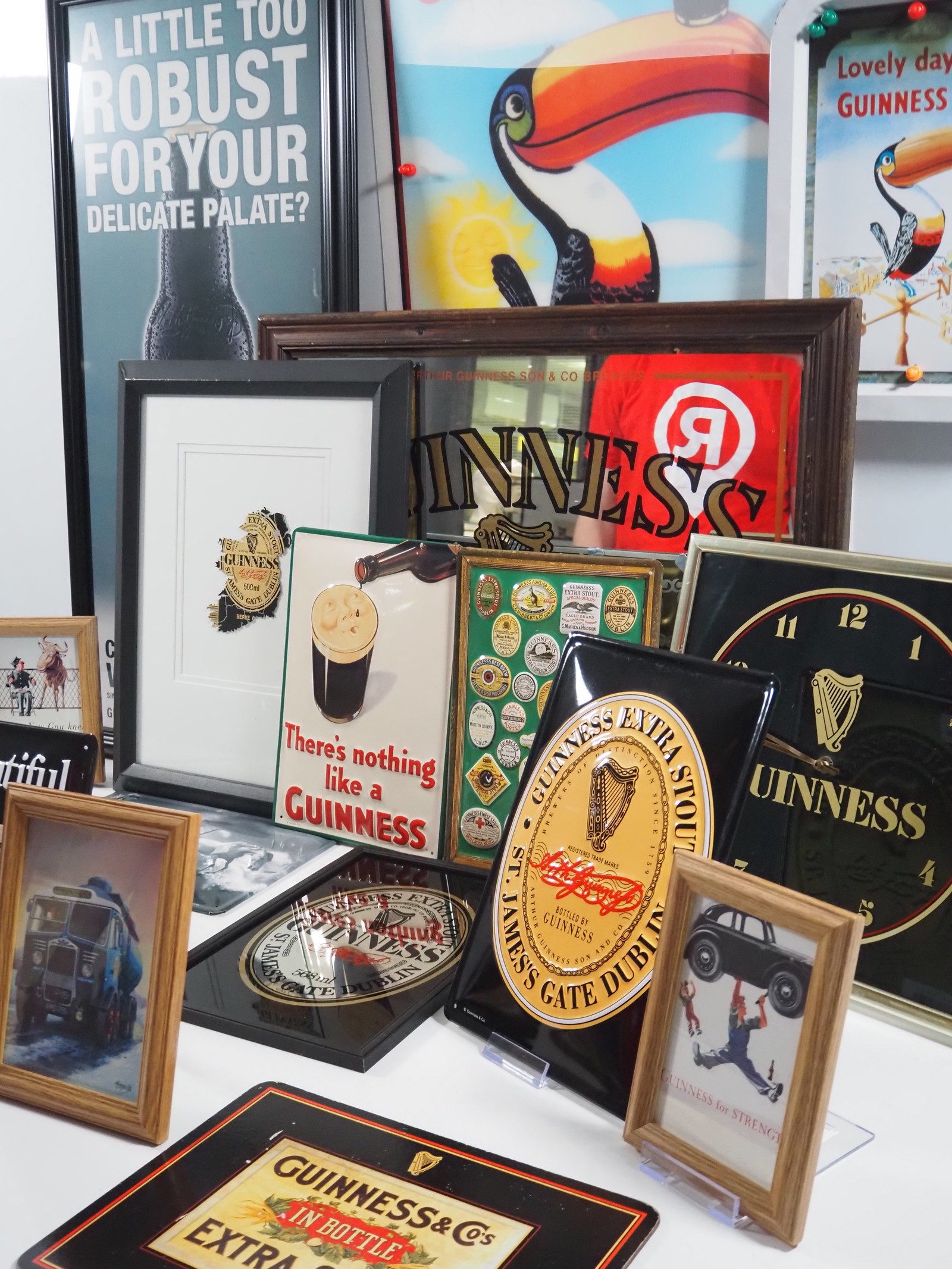 Lot 394 - A collection of Guinness reproductions tin