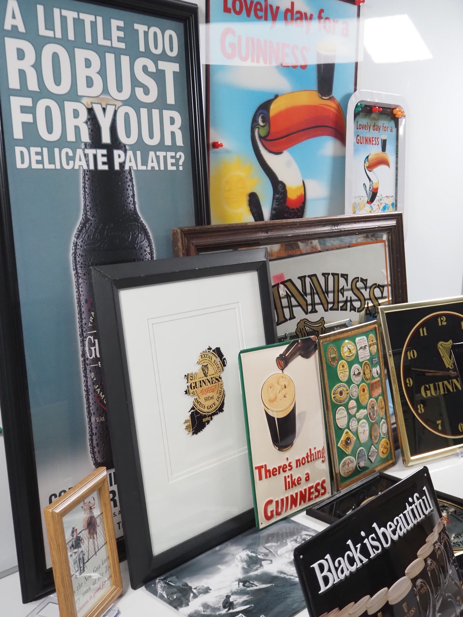 Lot 394 - A collection of Guinness reproductions tin
