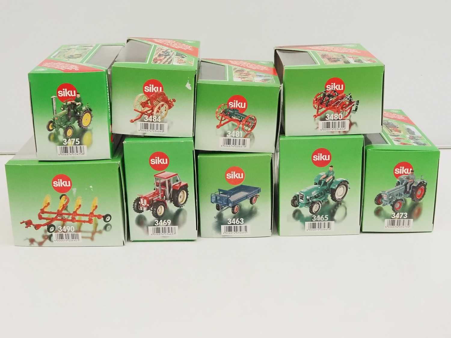 Lot 86 - A group of SIKU 1:32 scale diecast tractors,