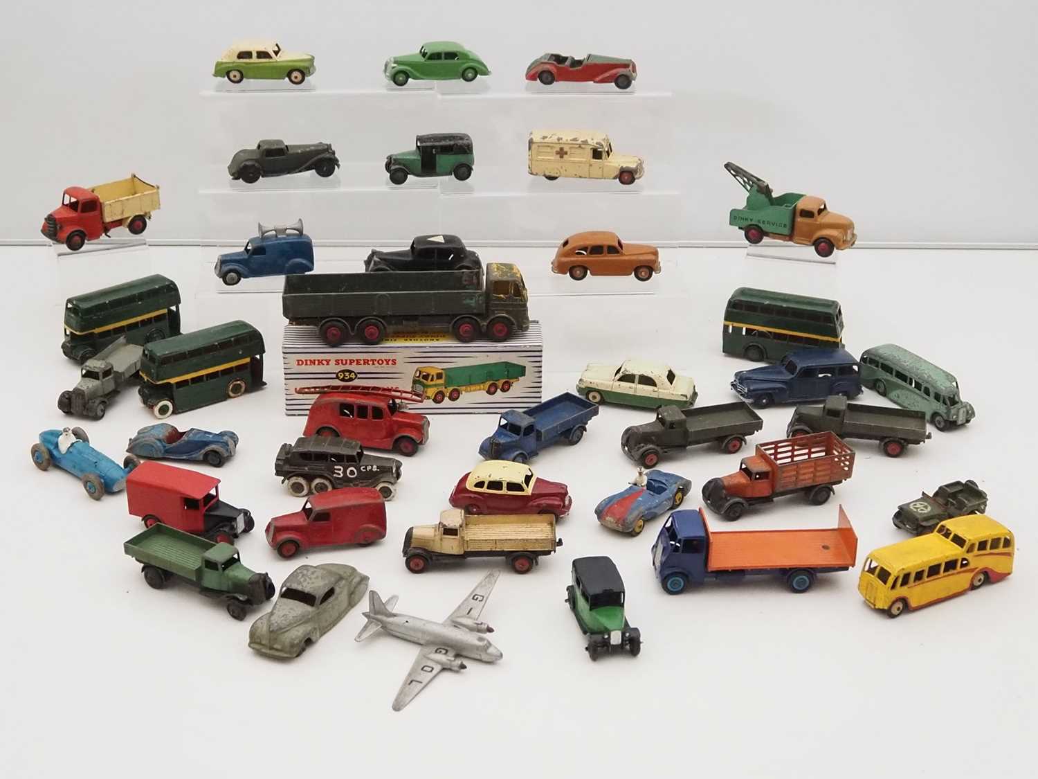Lot 277 - A large group of playworn DINKY cars, buses