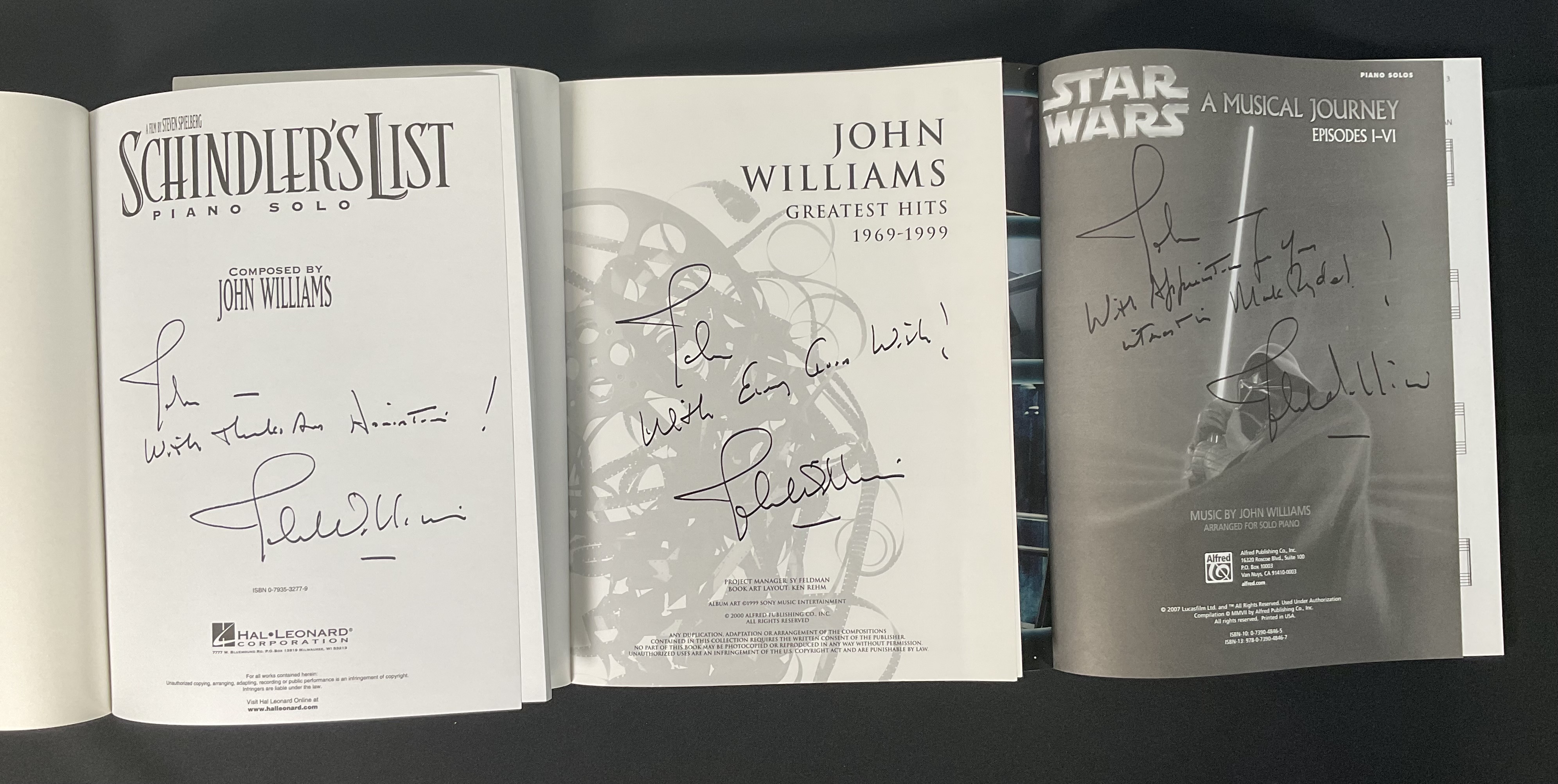 Lot 425 - A group of three JOHN WILLIAMS signed sheet