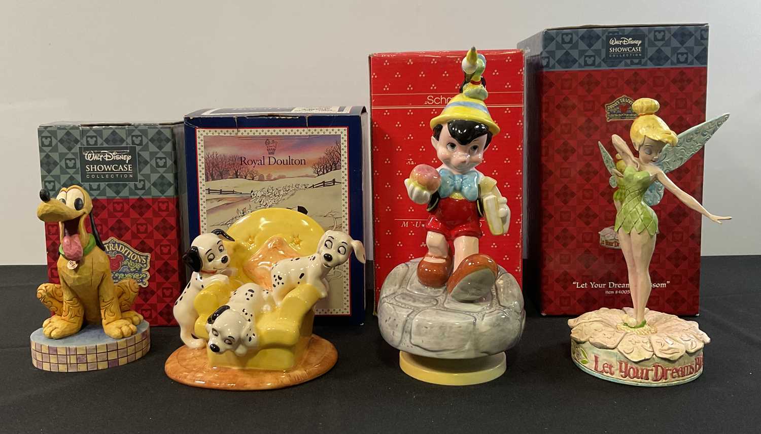 Lot 535 - A group of 4 Walt Disney ceramic figures
